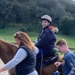 mindy leading a rider - SLO Horse News