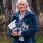 Christy with books -s - SLO Horse News
